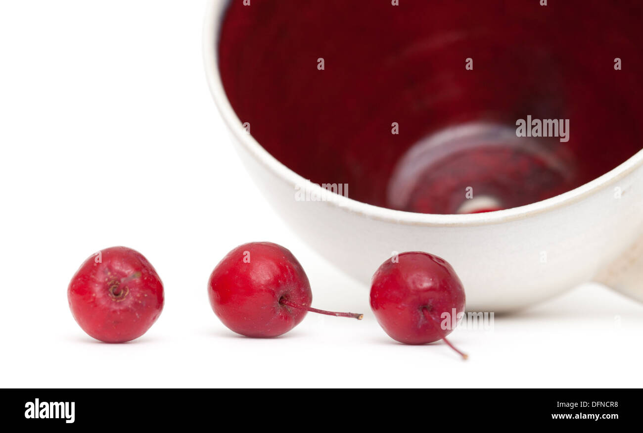 crabapples and red and white cup isolated Stock Photo - Alamy