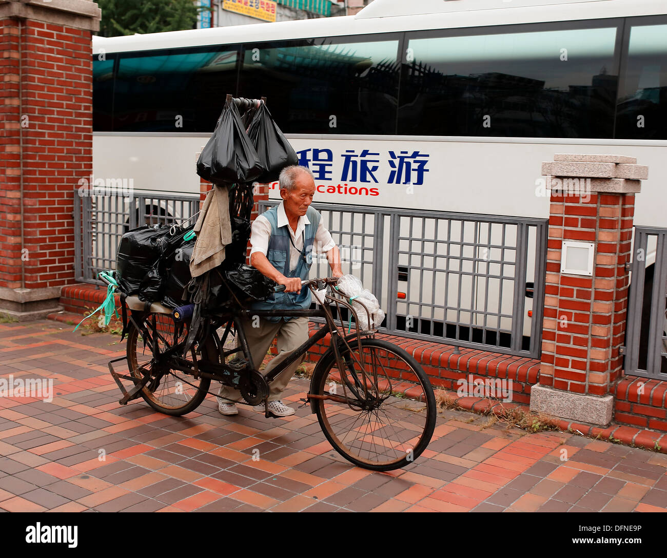 Old man with cycle hi-res stock photography and images - Alamy