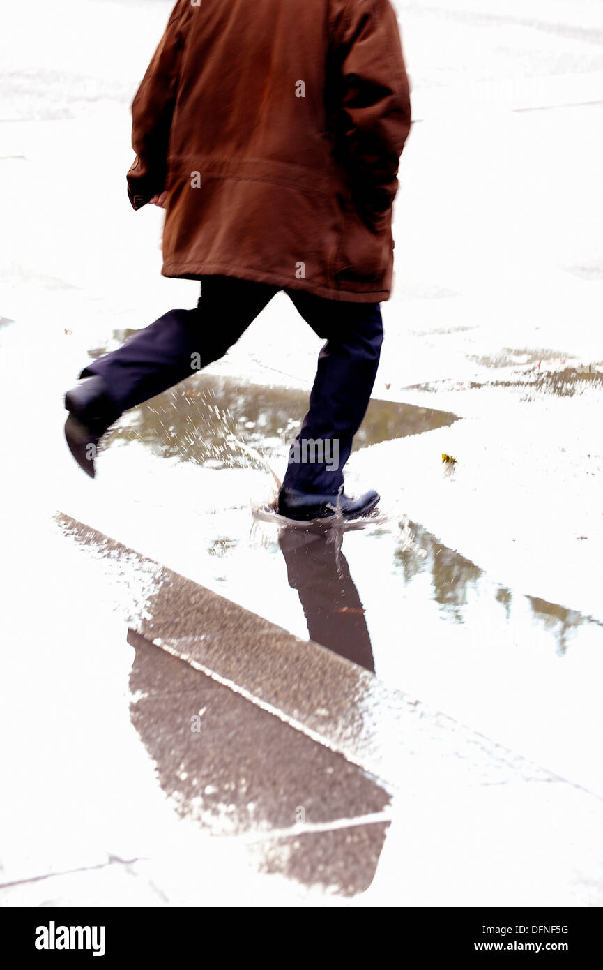 Man puddle coat hi-res stock photography and images - Alamy