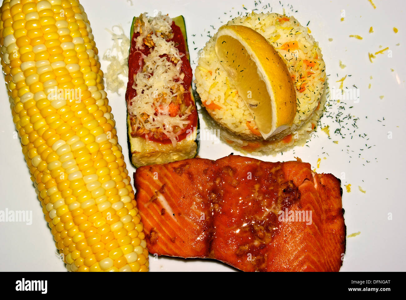 Barbecue grilled teriyaki salmon fish main course corn on cob zucchini ...