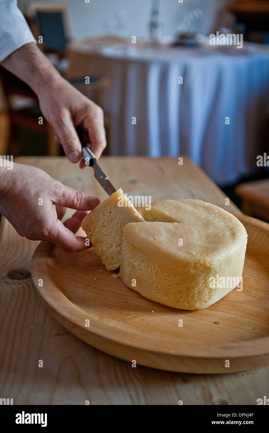 One man cutting cheese with knife, Bavaria, Germany Stock Photo - Alamy