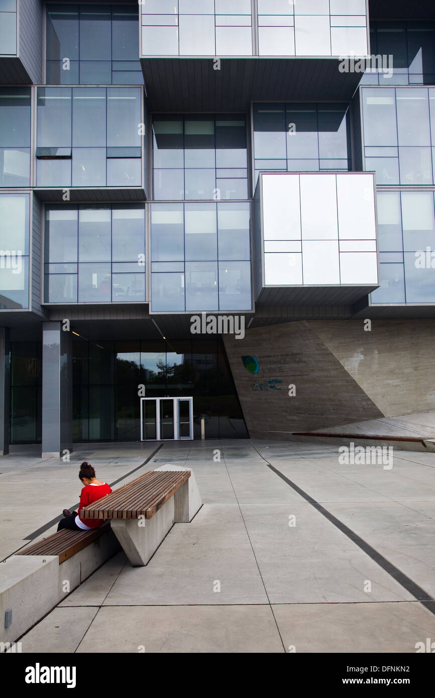 Female student sitting by the Pharmaceutical Sciences building at UBC ...