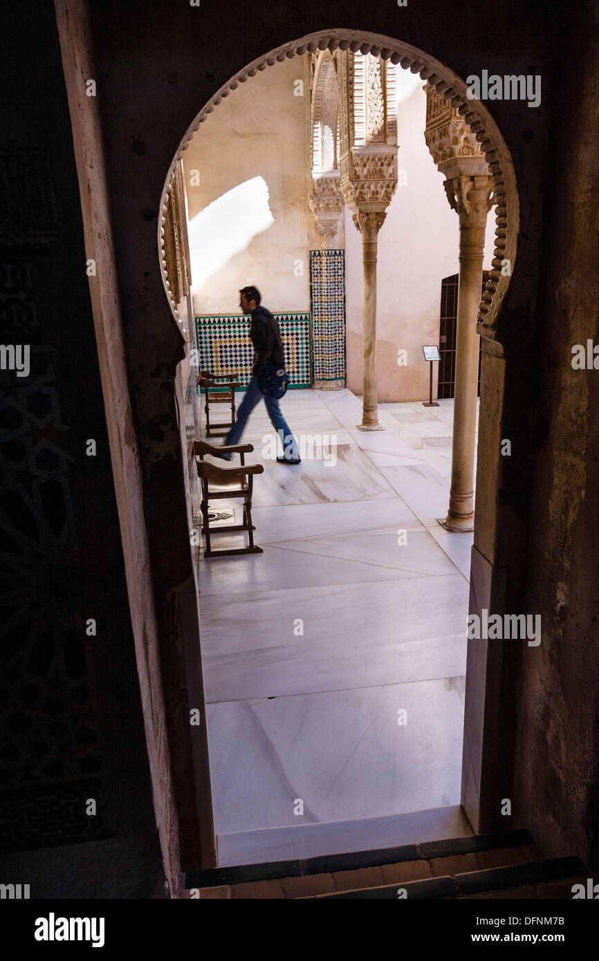Alhambra palace room seen through the hollow of a Moorish door. Granada ...