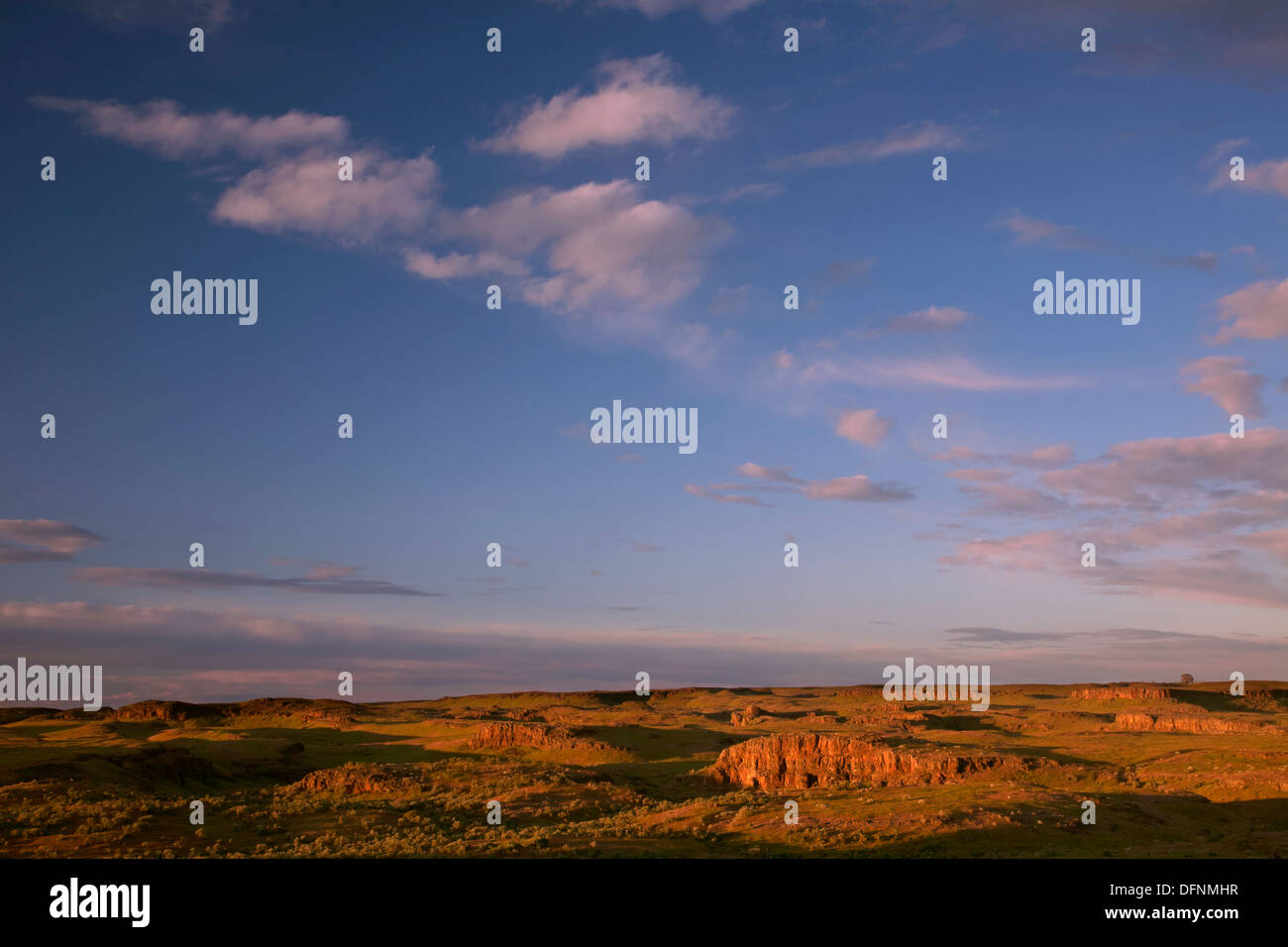 WA08383-00...WASHINGTON - Sunset over the prairie lands and buttes of ...