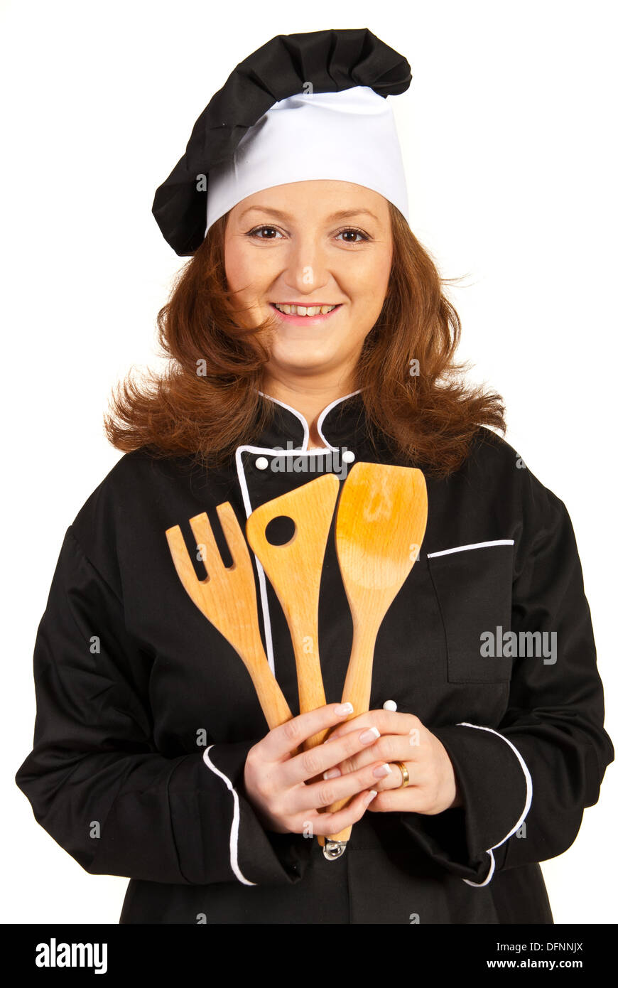 Happy chef woman showing wooden kitchen utensils isolated on white ...