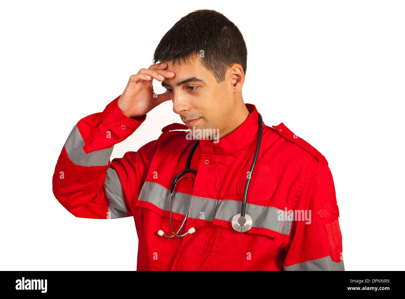 Pensive paramedic man holding hand to head isolated on white background ...