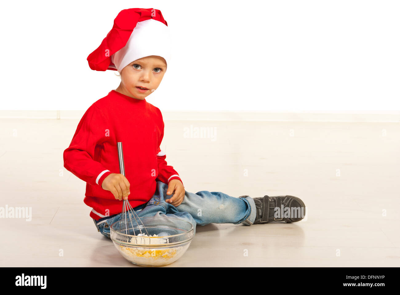 Chef boy preparing food in bowl isolated on white background Stock ...