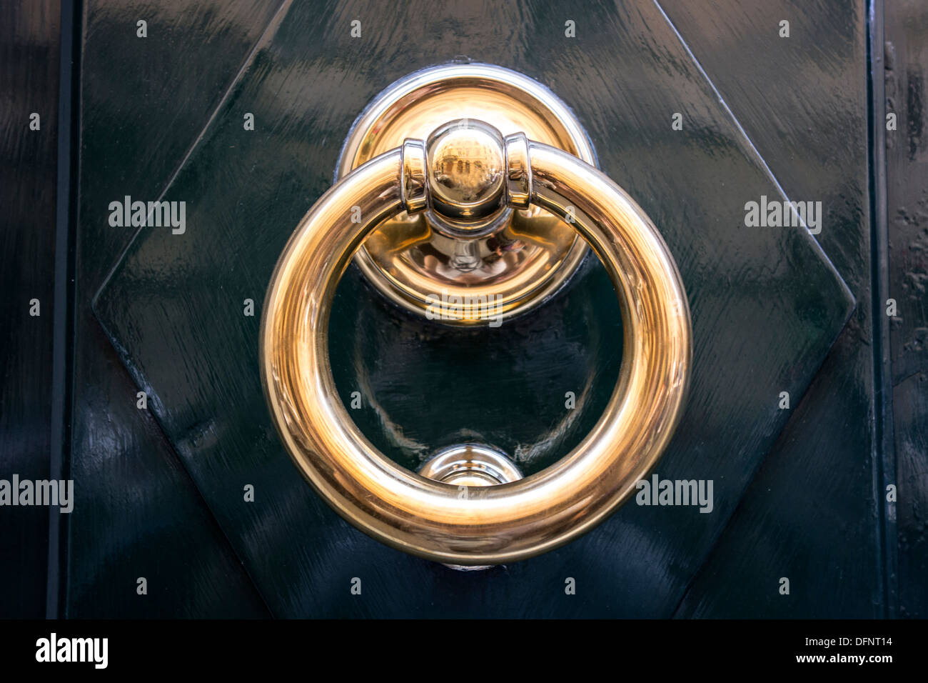 circle iron door-handle on black door Stock Photo - Alamy