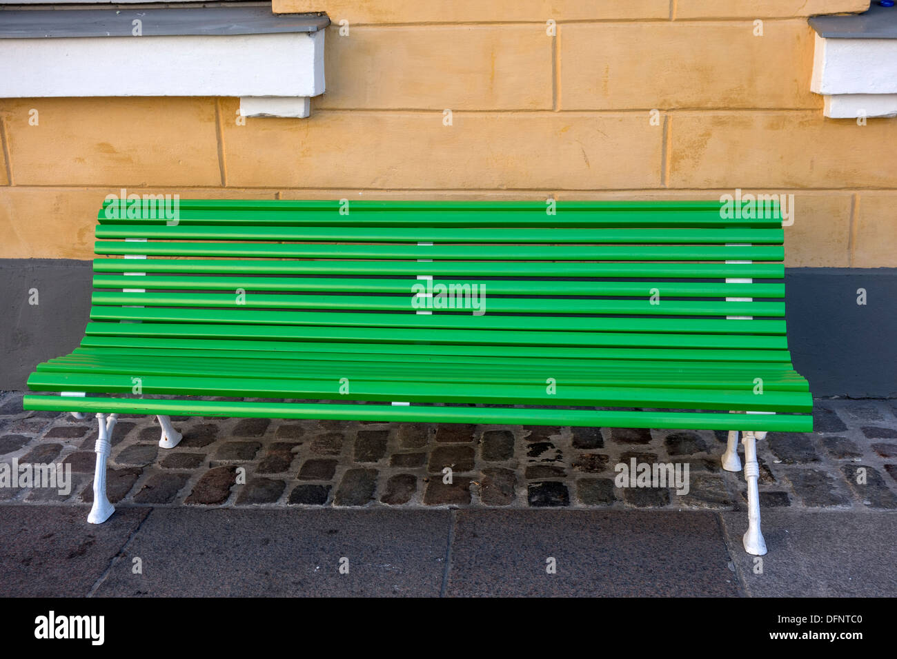 Green bench in the street Stock Photo - Alamy