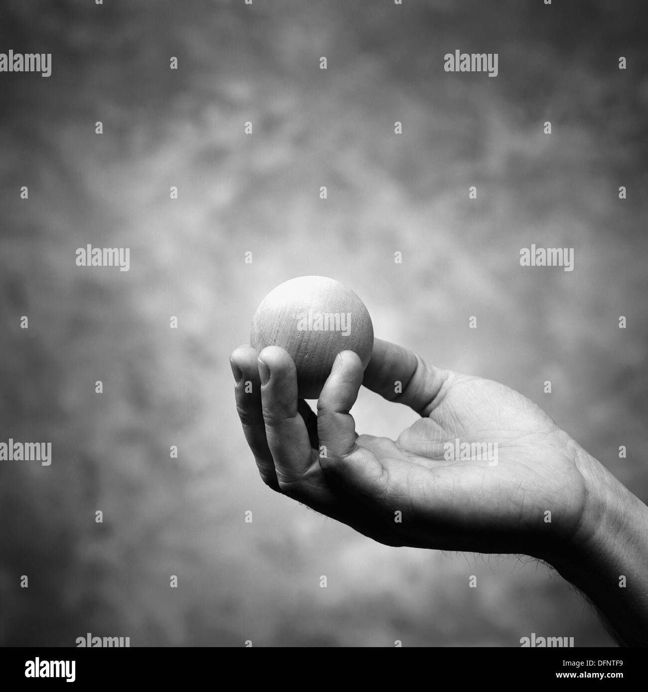 Hand detail holding ball one Black and White Stock Photos & Images - Alamy