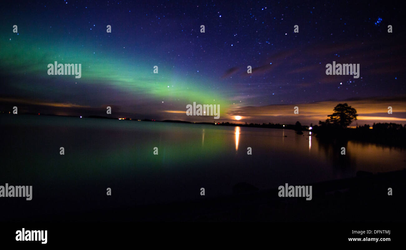 Northern lights over forest in hi-res stock photography and images - Alamy