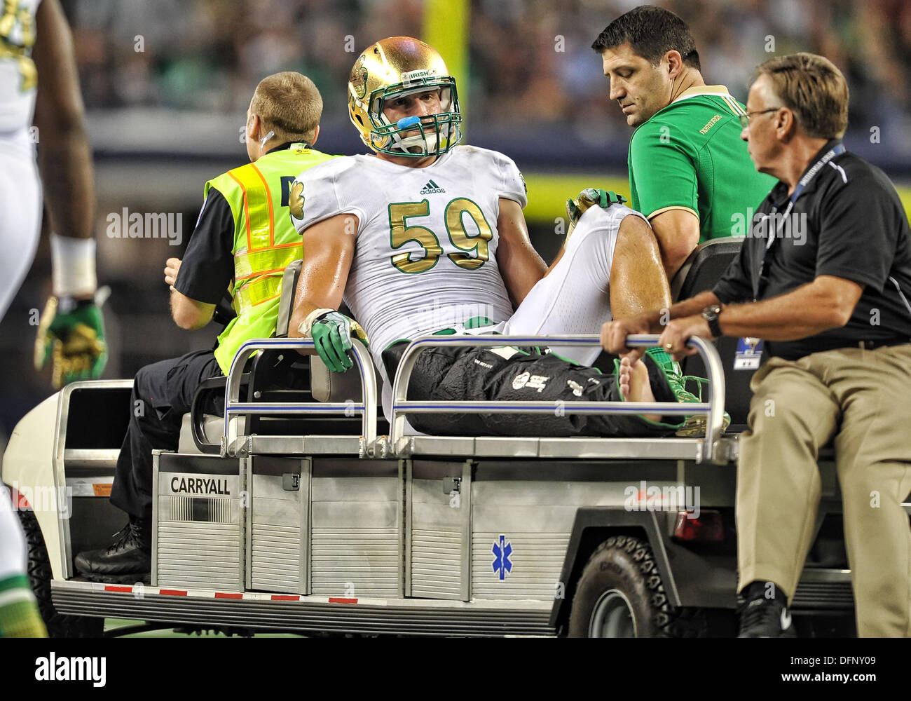 Notre Dame Fighting Irish linebacker Jarrett Grace (59) breaks his leg ...