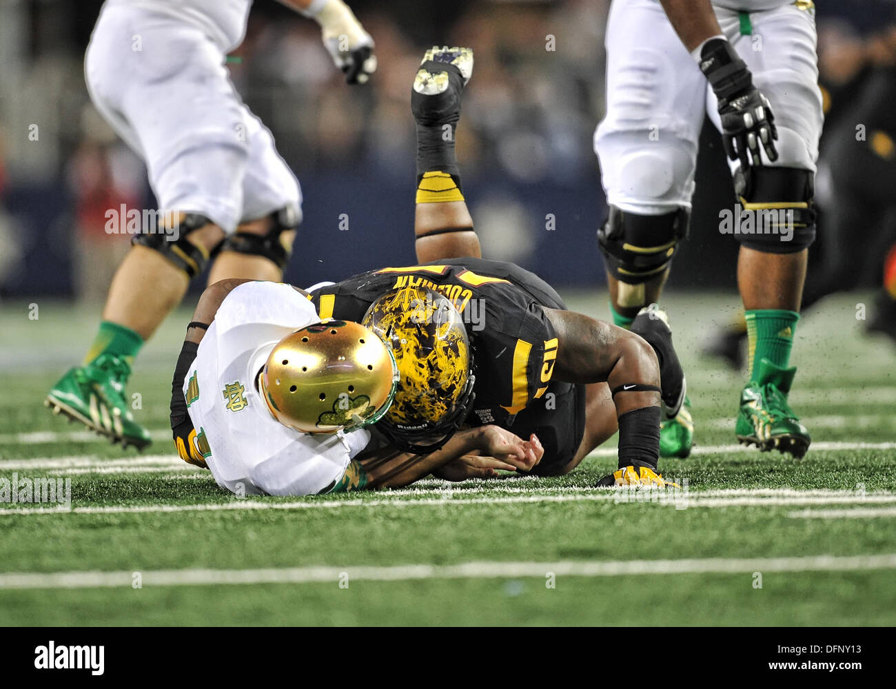 Notre Dame Fighting Irish quarterback Tommy Rees (11) is hit hard by ...