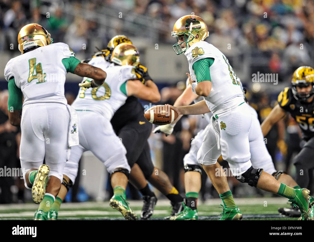 Notre Dame Fighting Irish quarterback Tommy Rees (11) hands off the ball to Notre Dame Fighting ...