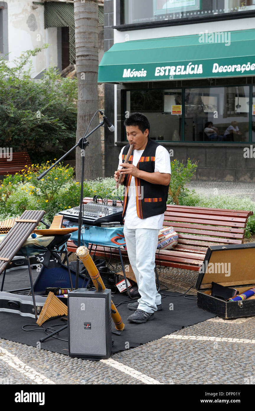 Street musician playing flute busking hi-res stock photography and ...