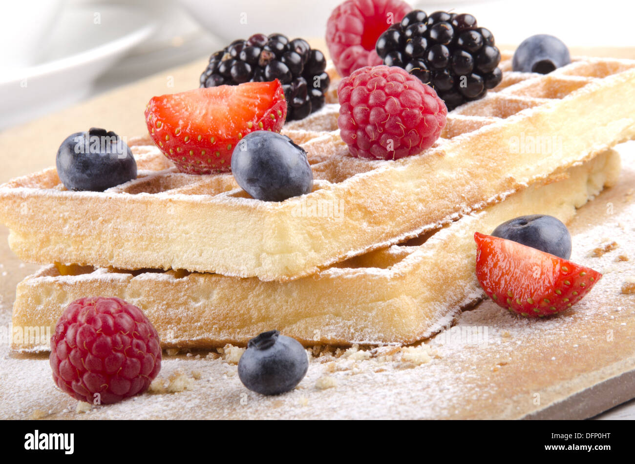 home made waffle with fruit and powdered sugar Stock Photo - Alamy