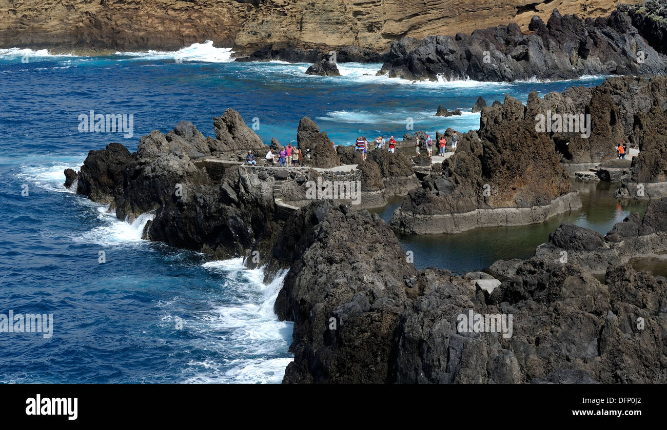 Madeira Portugal. Tourists visiting the lava pools in the coastal ...