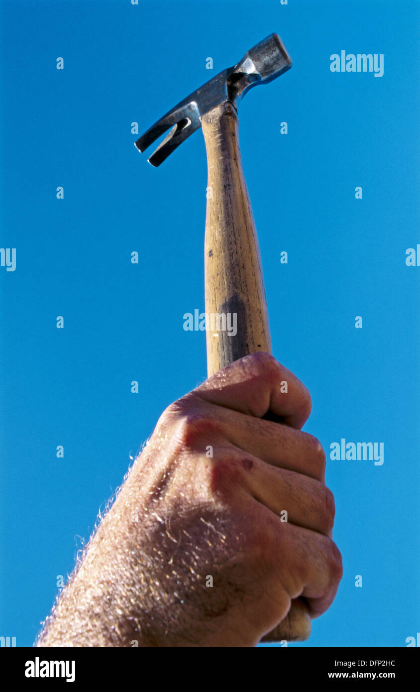 Hammer and arm Stock Photo - Alamy
