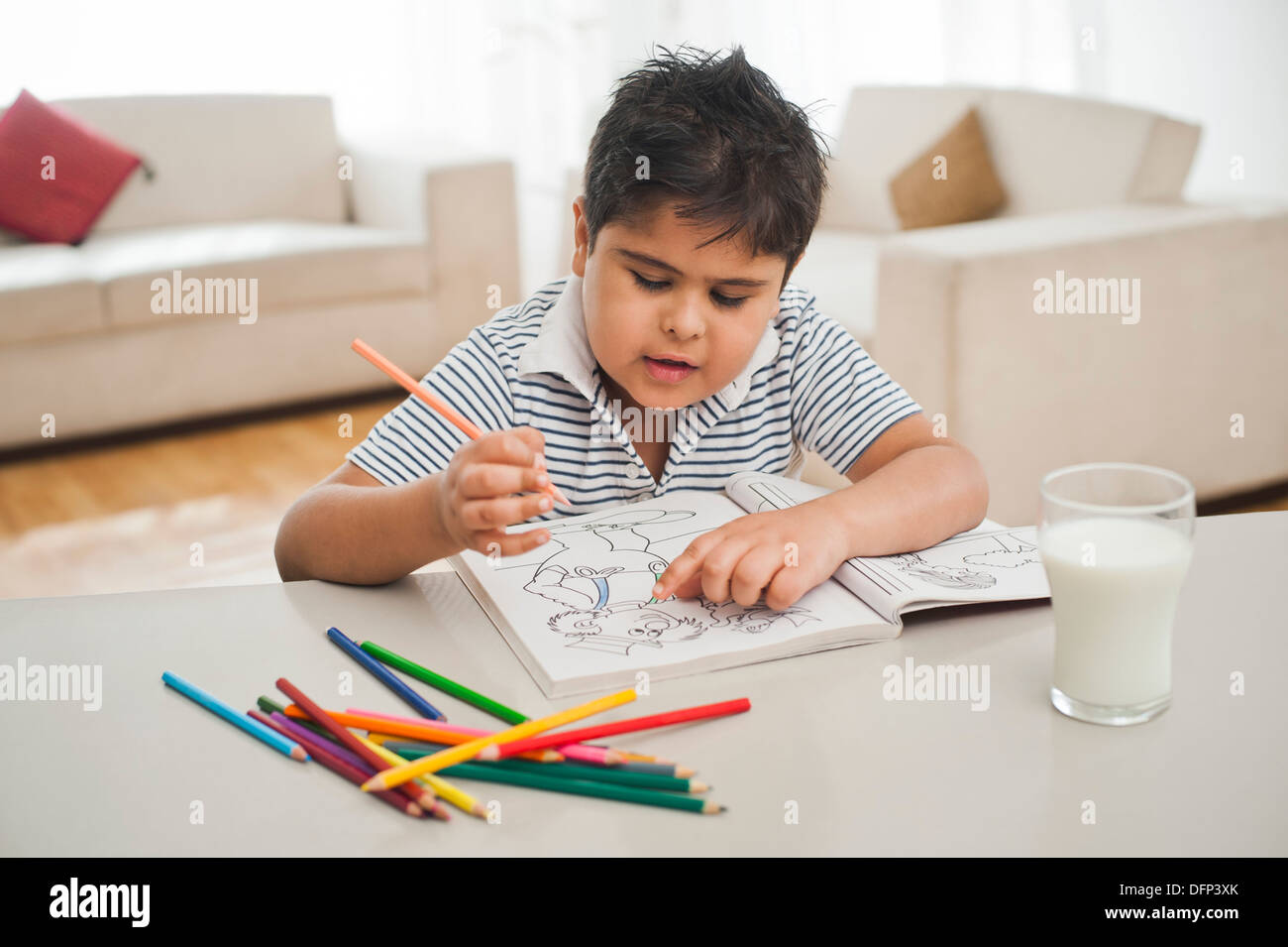 Boy Coloring With Crayons