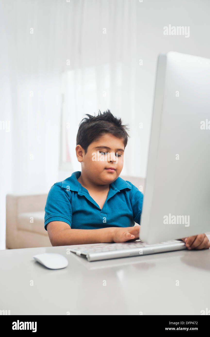 Boy using a computer Stock Photo - Alamy