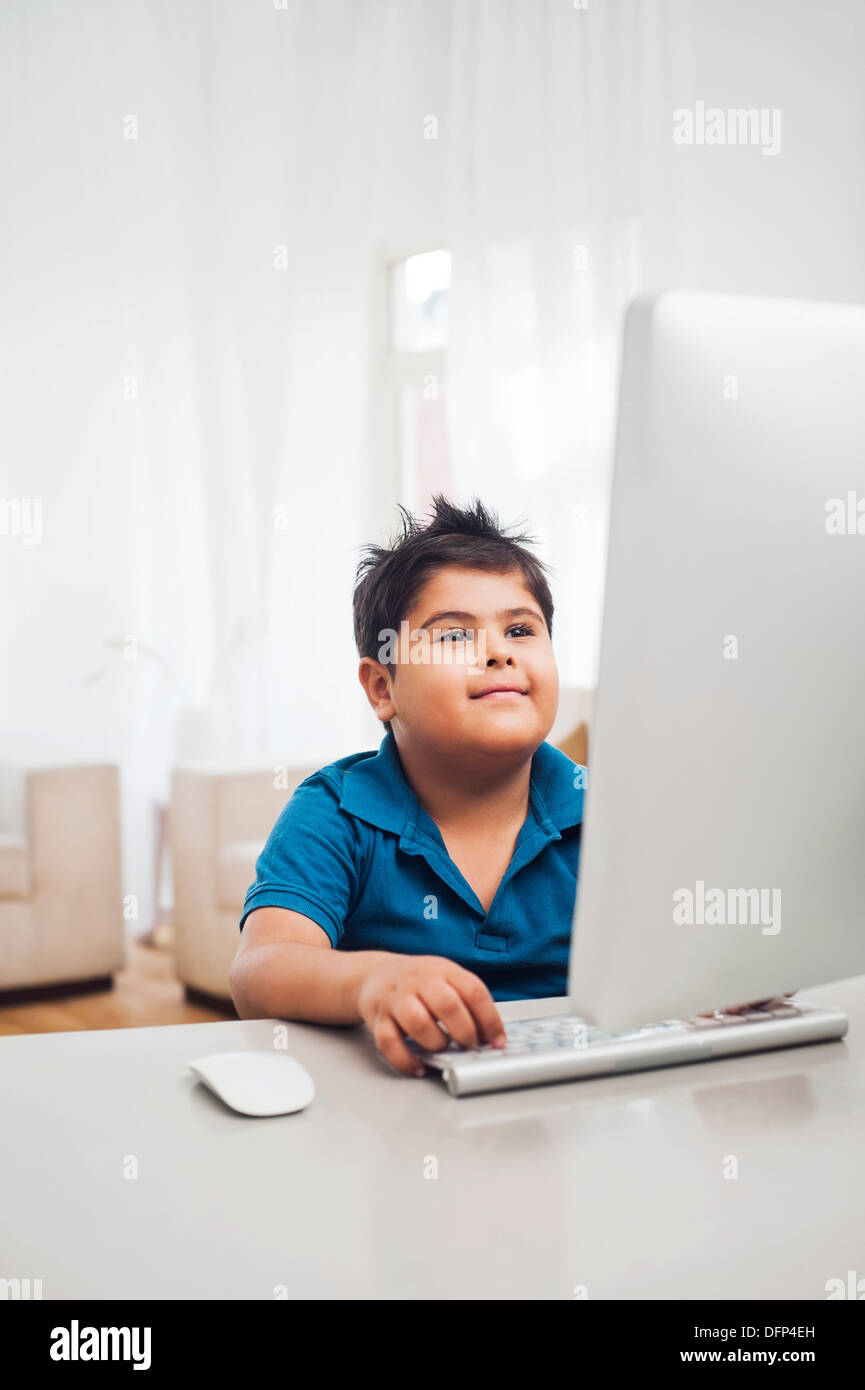Boy using a computer Stock Photo - Alamy