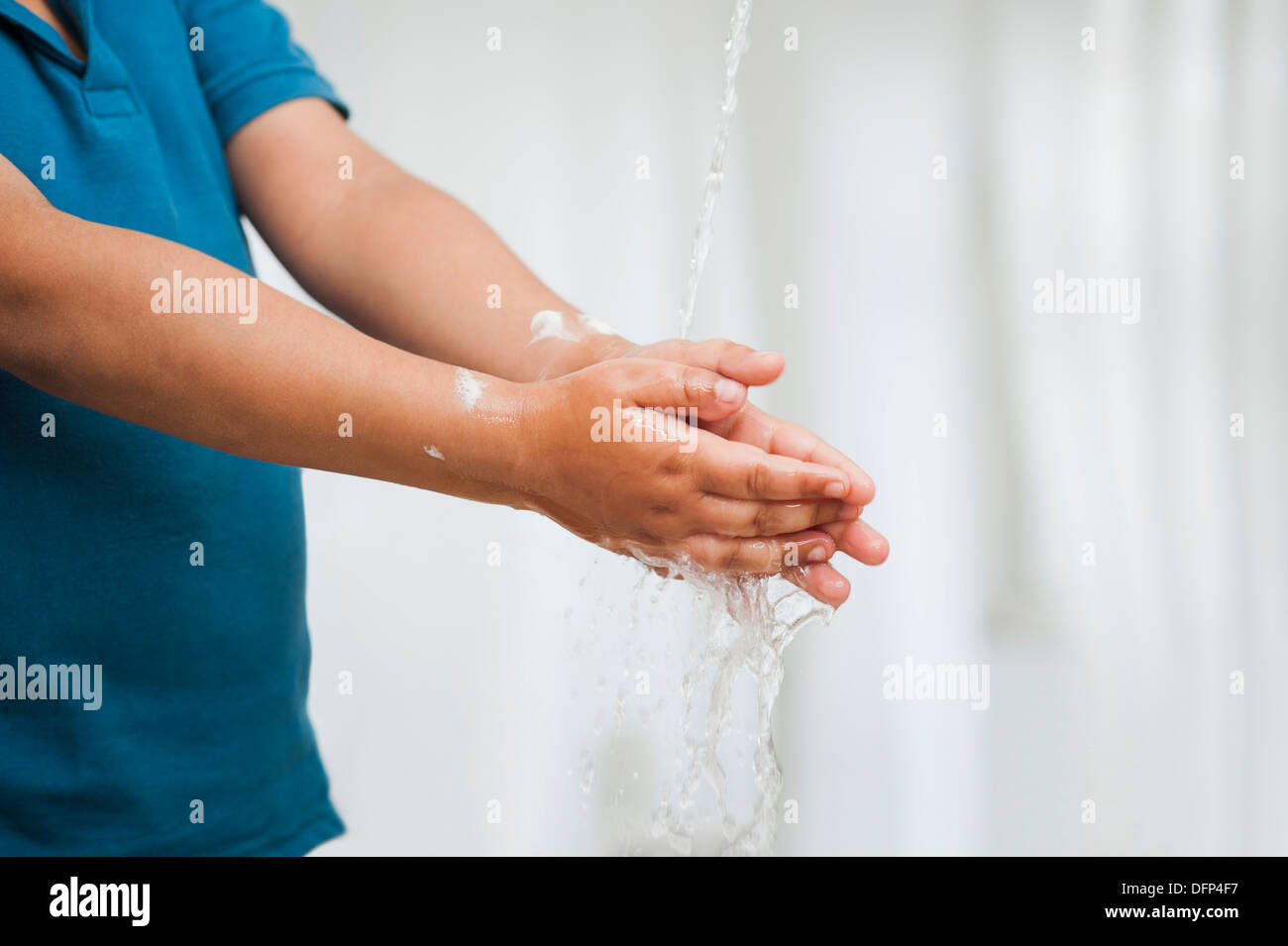 Close-up of a boy washing his hands Stock Photo - Alamy