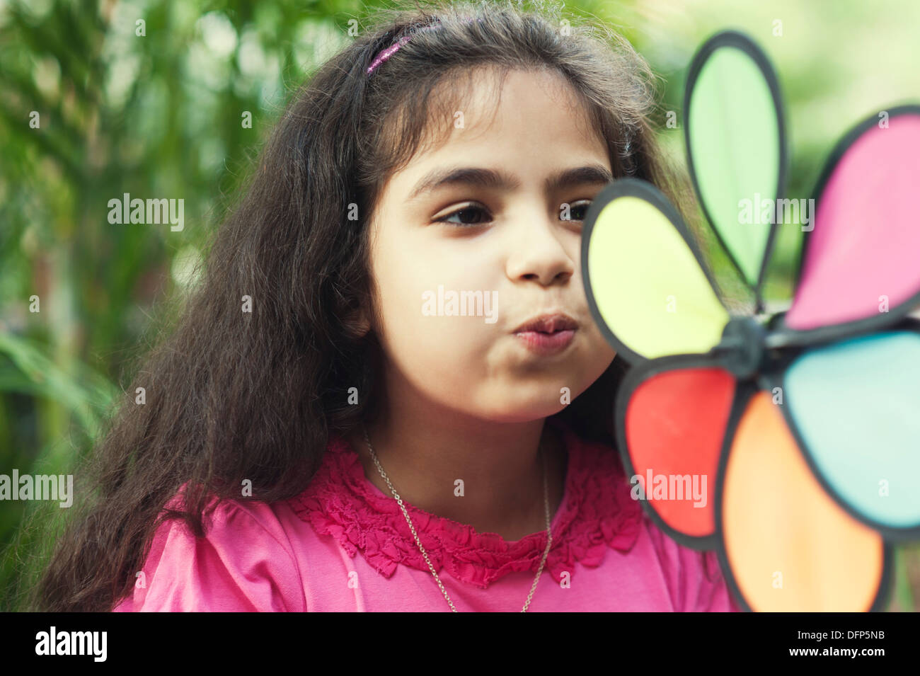 Girl with a pinwheel hi-res stock photography and images - Alamy