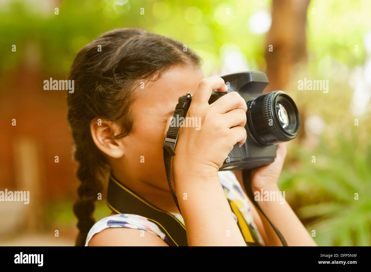 Girl photographing with a digital camera Stock Photo - Alamy