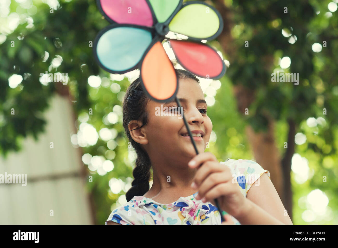 Girl with a pinwheel hi-res stock photography and images - Alamy