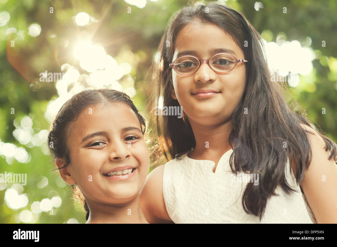 Portrait of two girls smiling Stock Photo - Alamy