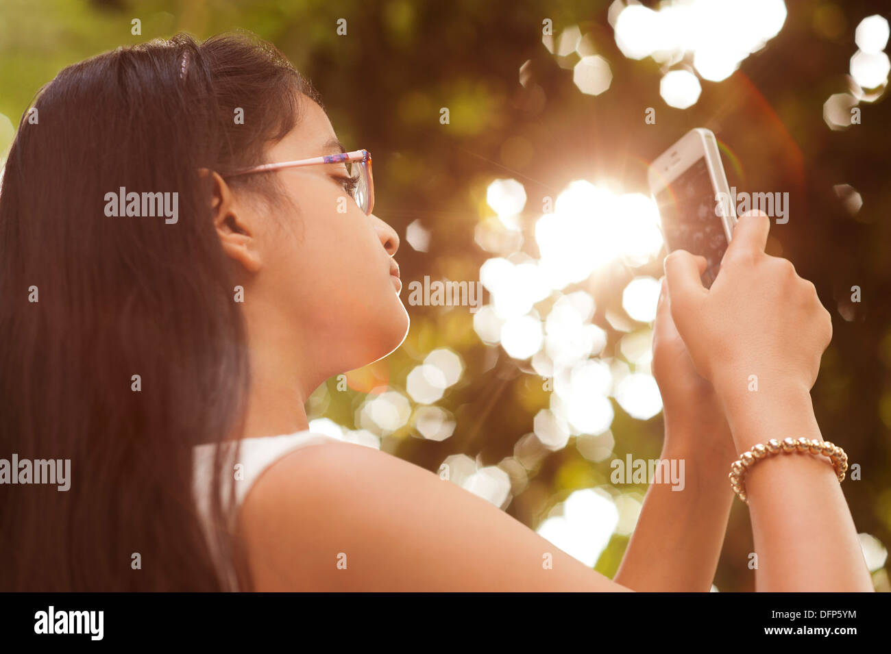 Girl using a mobile phone Stock Photo - Alamy