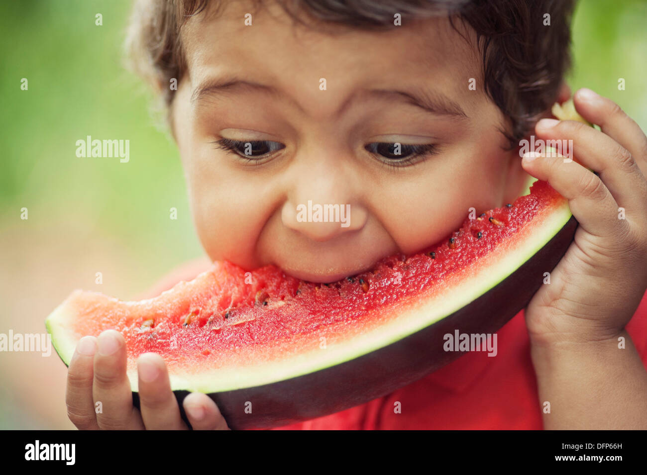 Baby boy eating a watermelon Stock Photo - Alamy