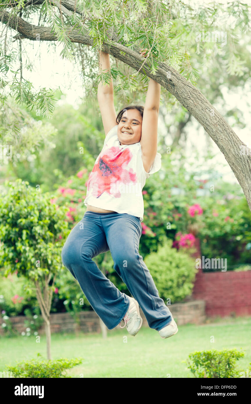 Girl hanging tree hi-res stock photography and images - Alamy