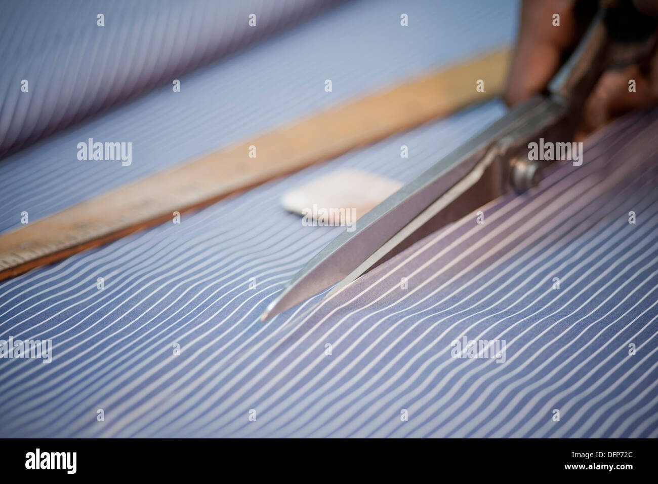 Close-up of a fabric being cut by scissors Stock Photo - Alamy
