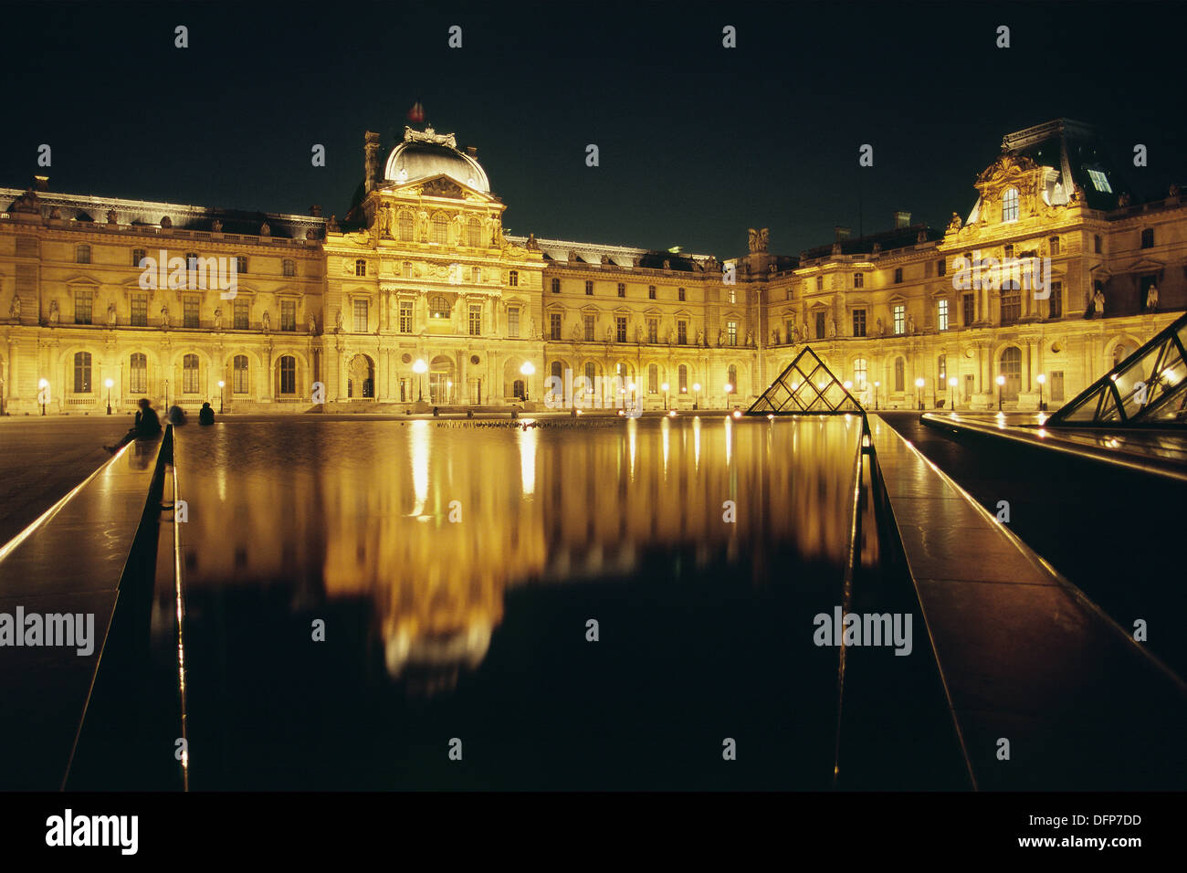 Grand Louvre art museum and Cour Napoleon by night, Paris. France Stock ...