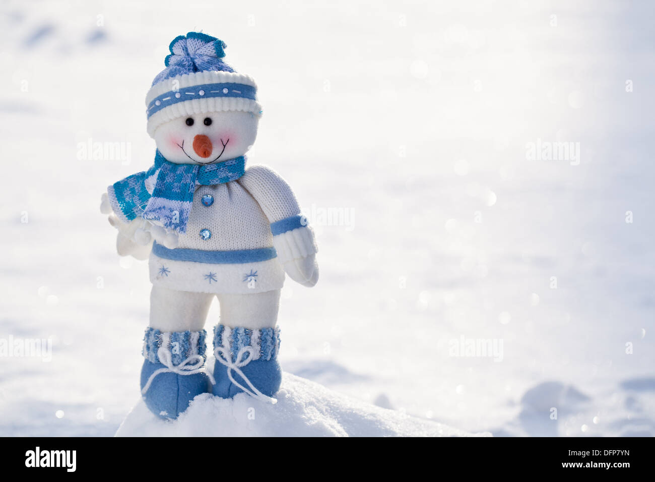 Little snowman with carrot nose in the snow Stock Photo - Alamy