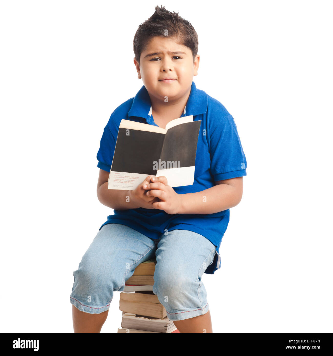 Boy reading a book Stock Photo - Alamy