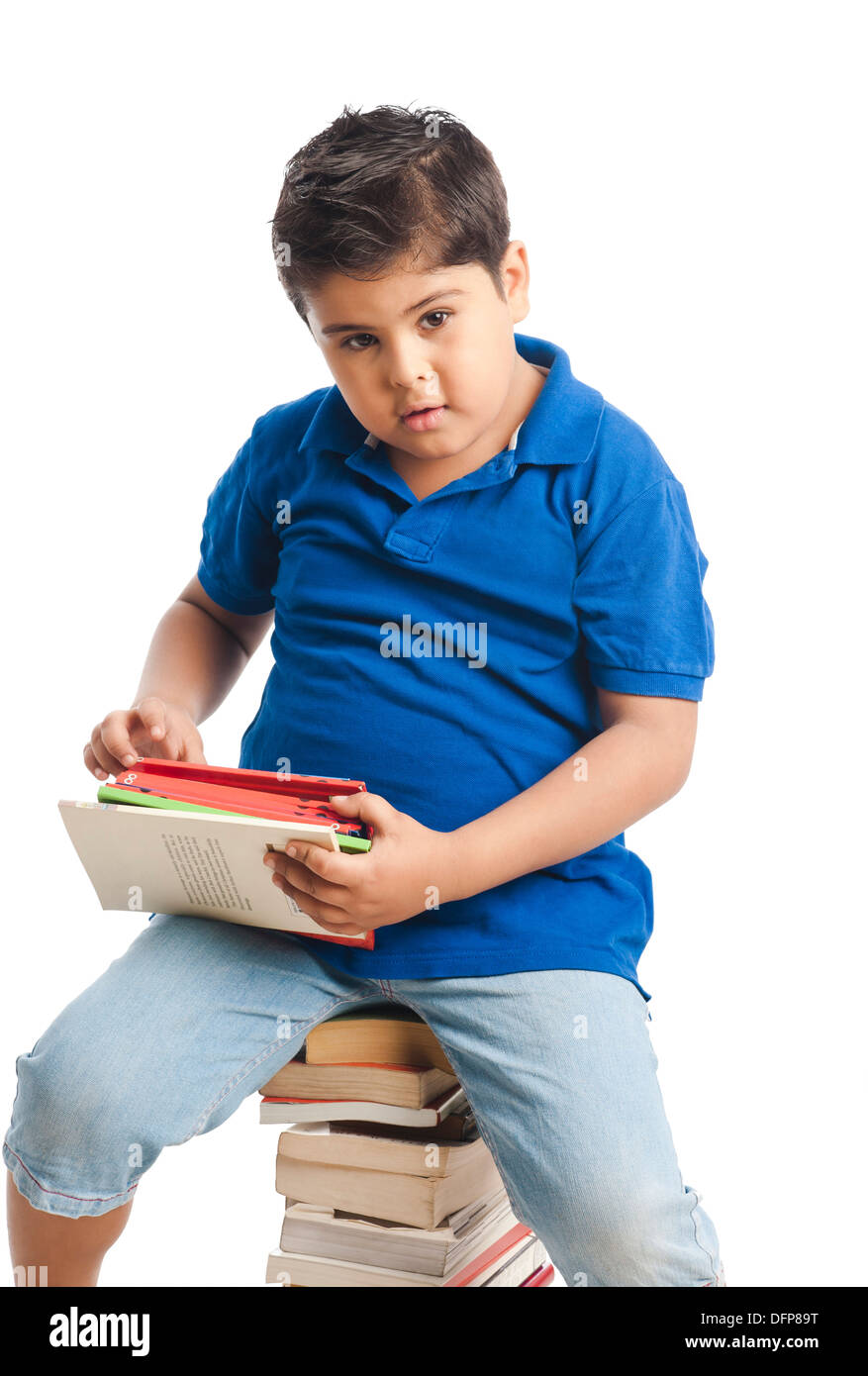Boy holding books Stock Photo - Alamy
