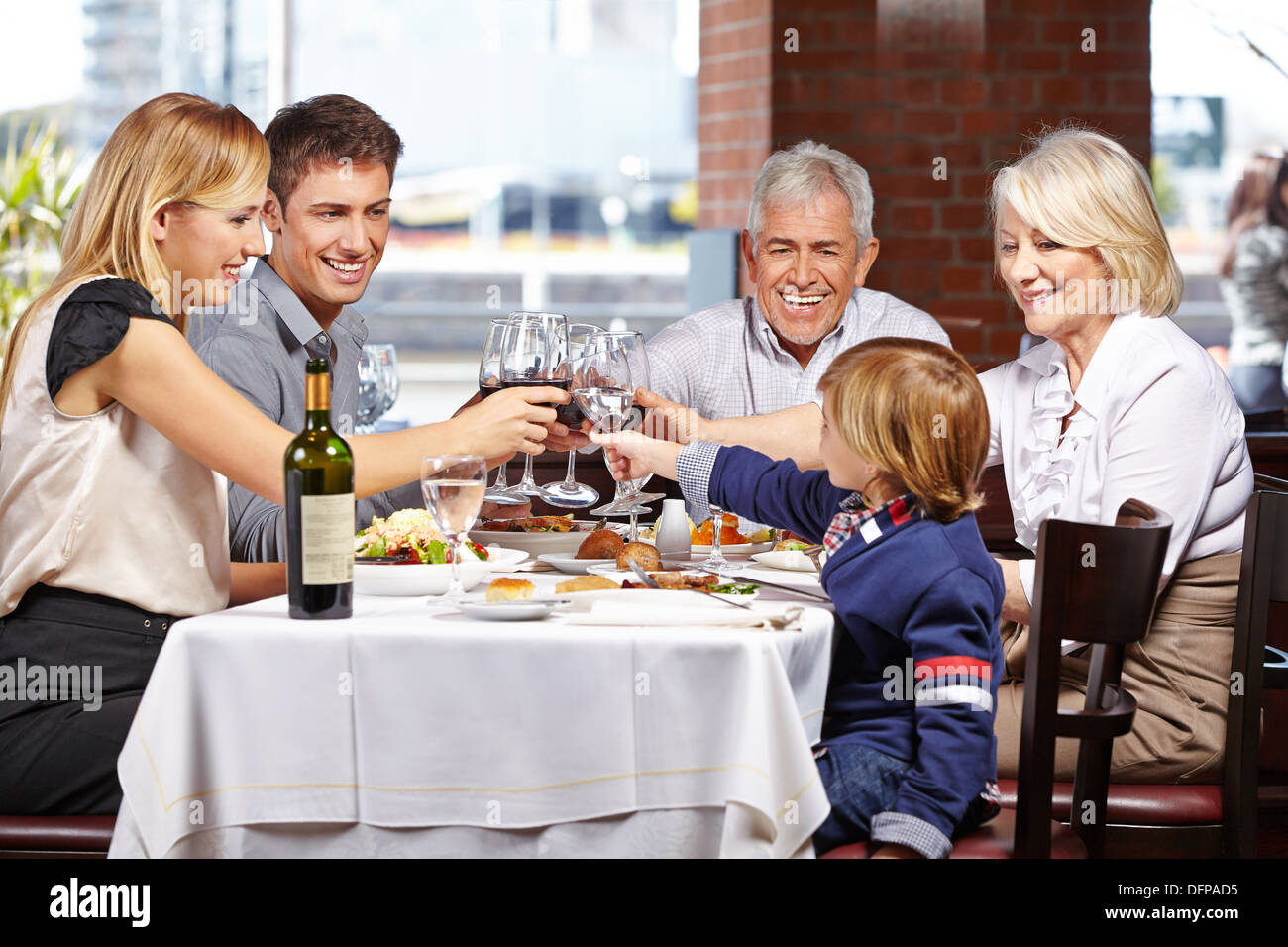 Family Eating At Fancy Restaurant
