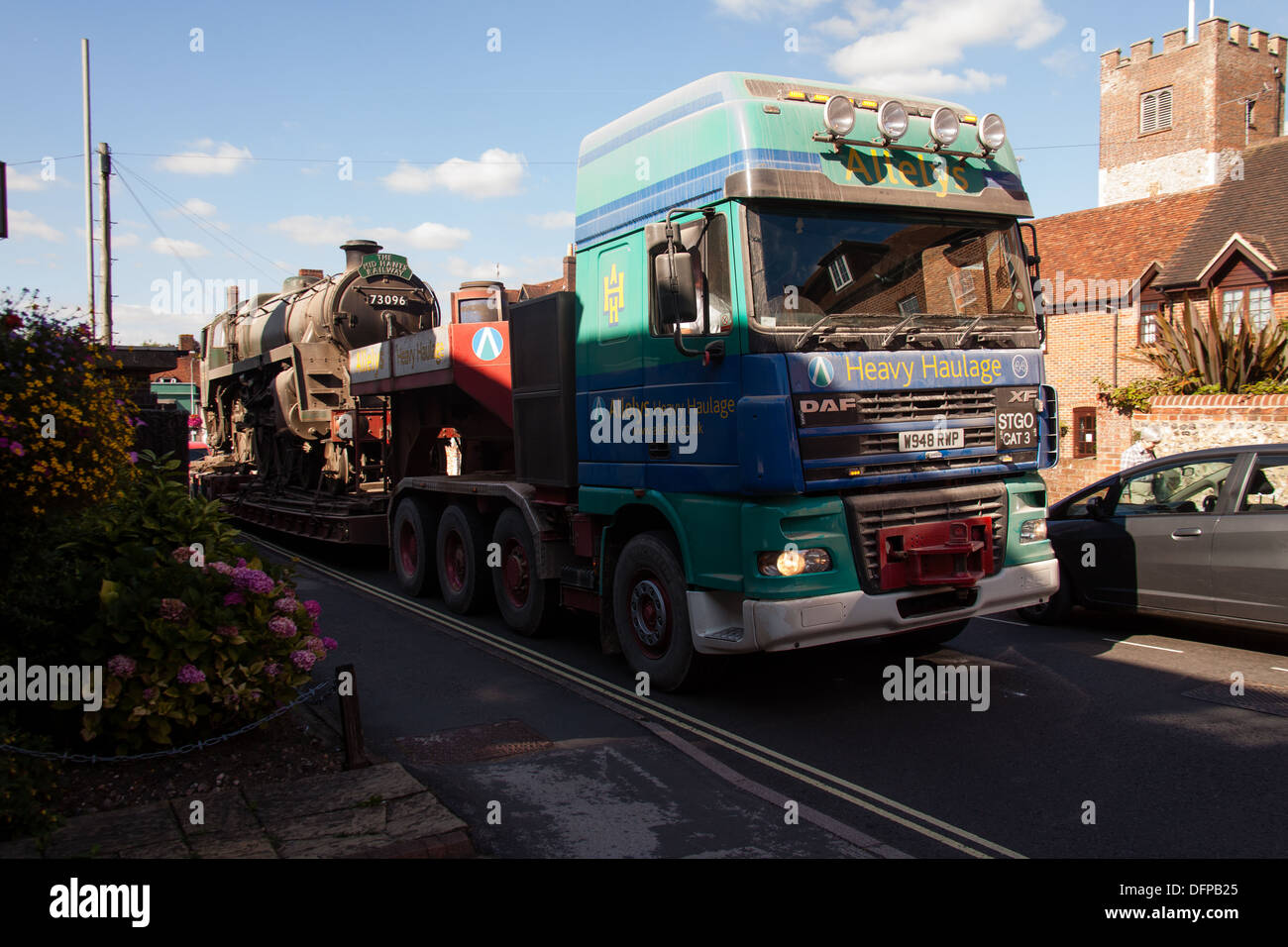 Steam locomotive engine being delivered on the back of a lorry ...