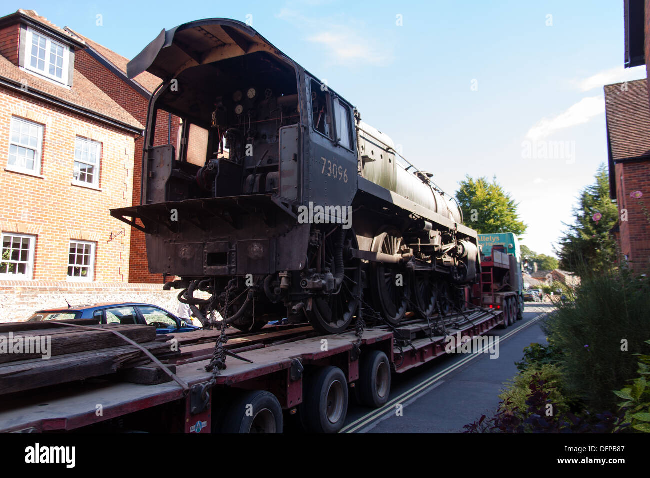 Steam locomotive engine being delivered on the back of a lorry ...