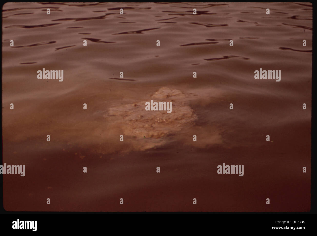 The floating sludge visible on the Nashua River is waste from paper ...