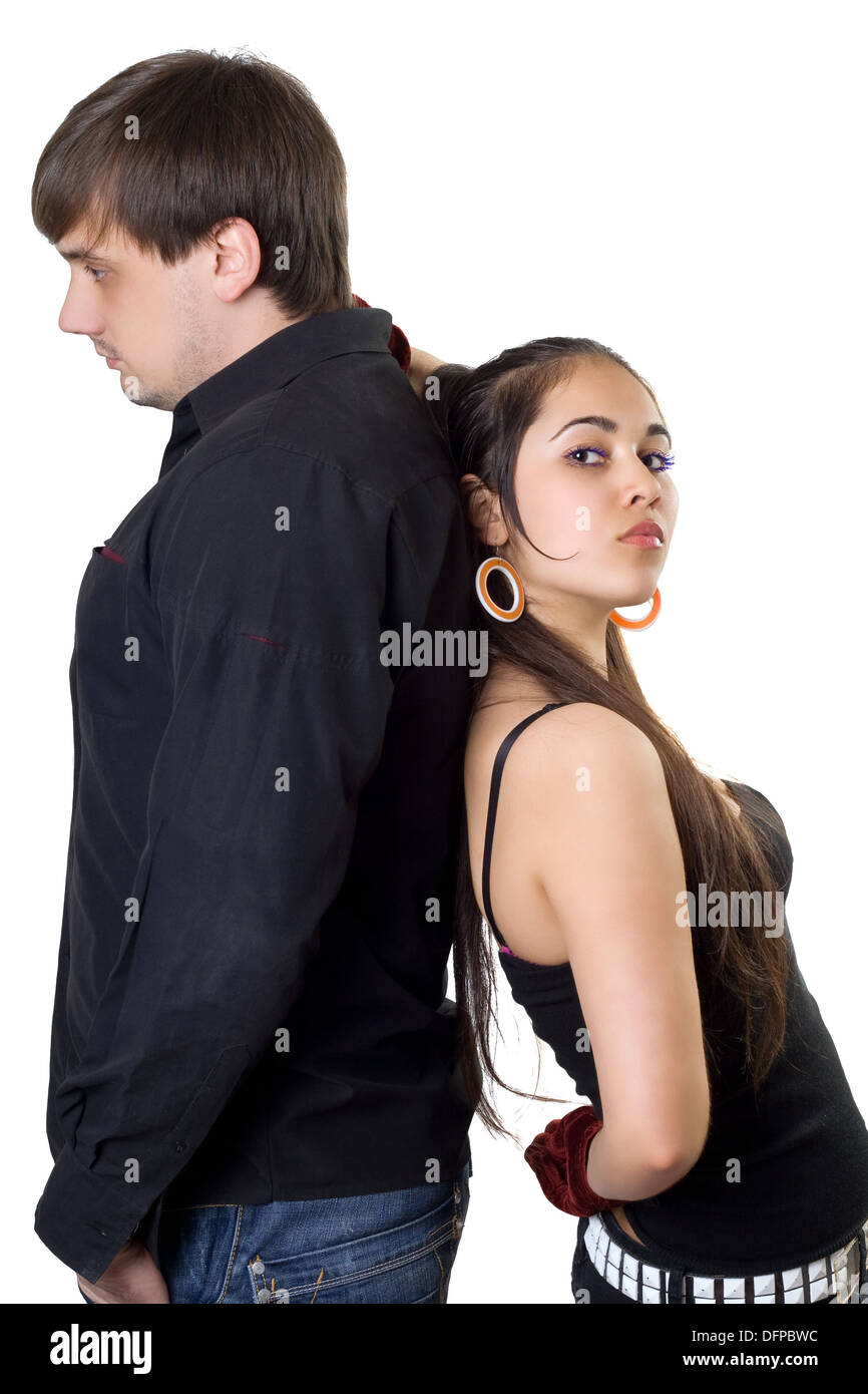 Young man and woman standing back-to-back. Isolated Stock Photo - Alamy