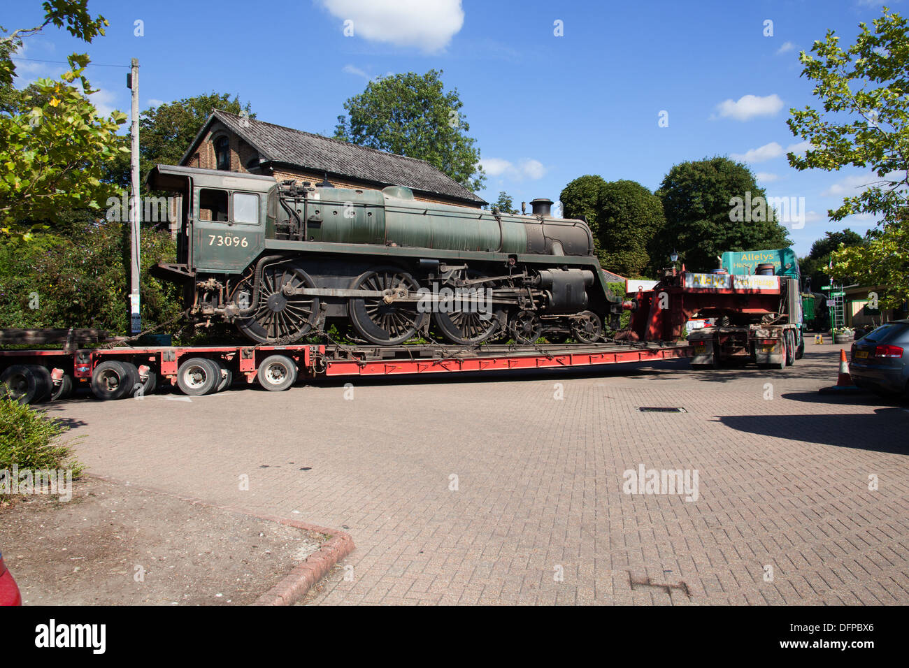 Steam locomotive engine being delivered on the back of a lorry ...
