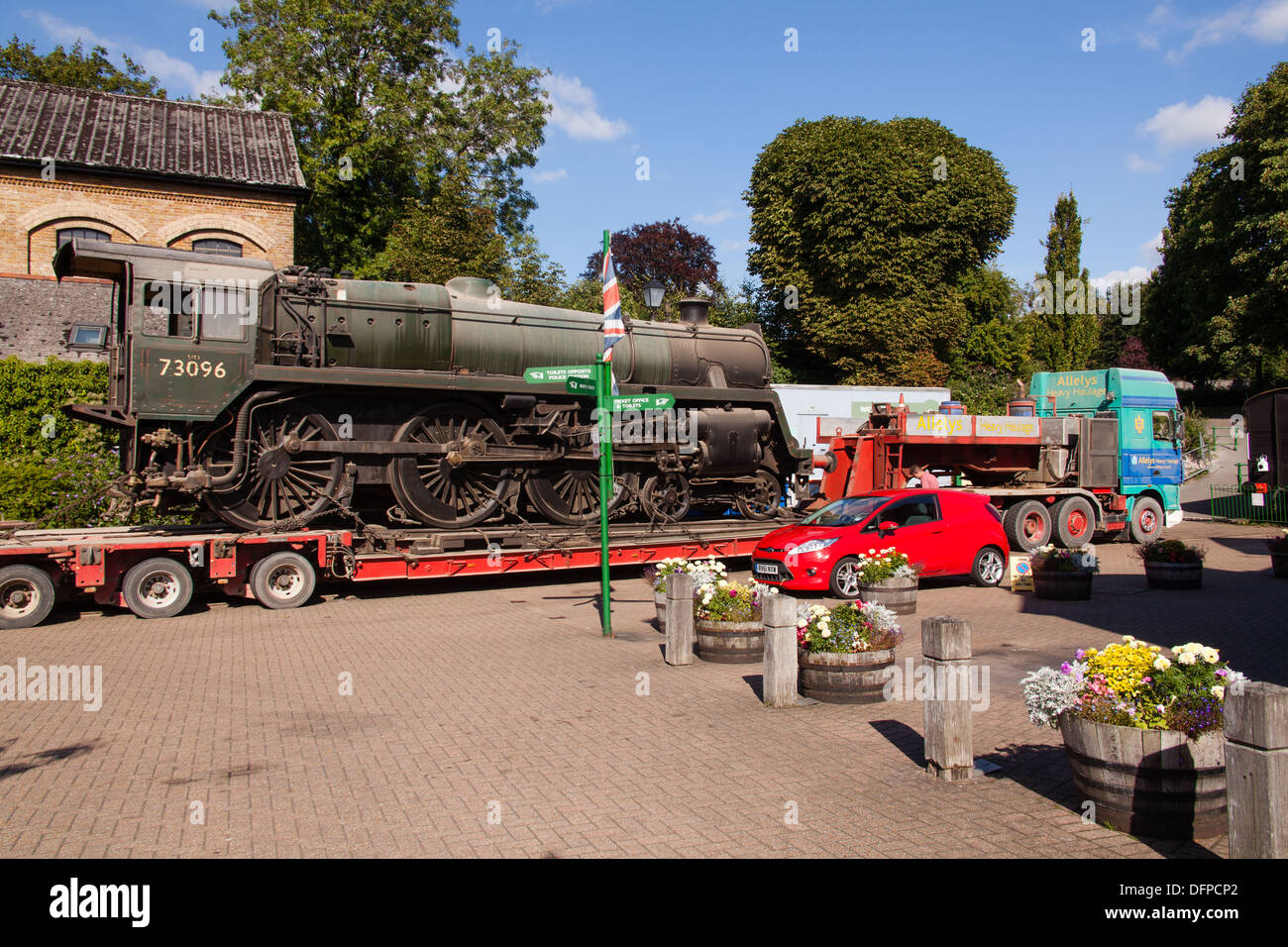 Steam locomotive engine being delivered on the back of a lorry ...