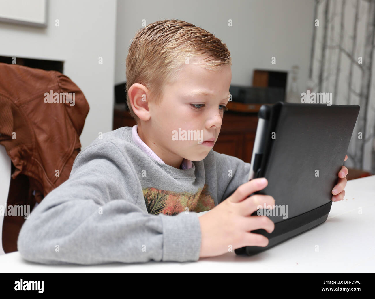 Boy using a tablet together Stock Photo - Alamy