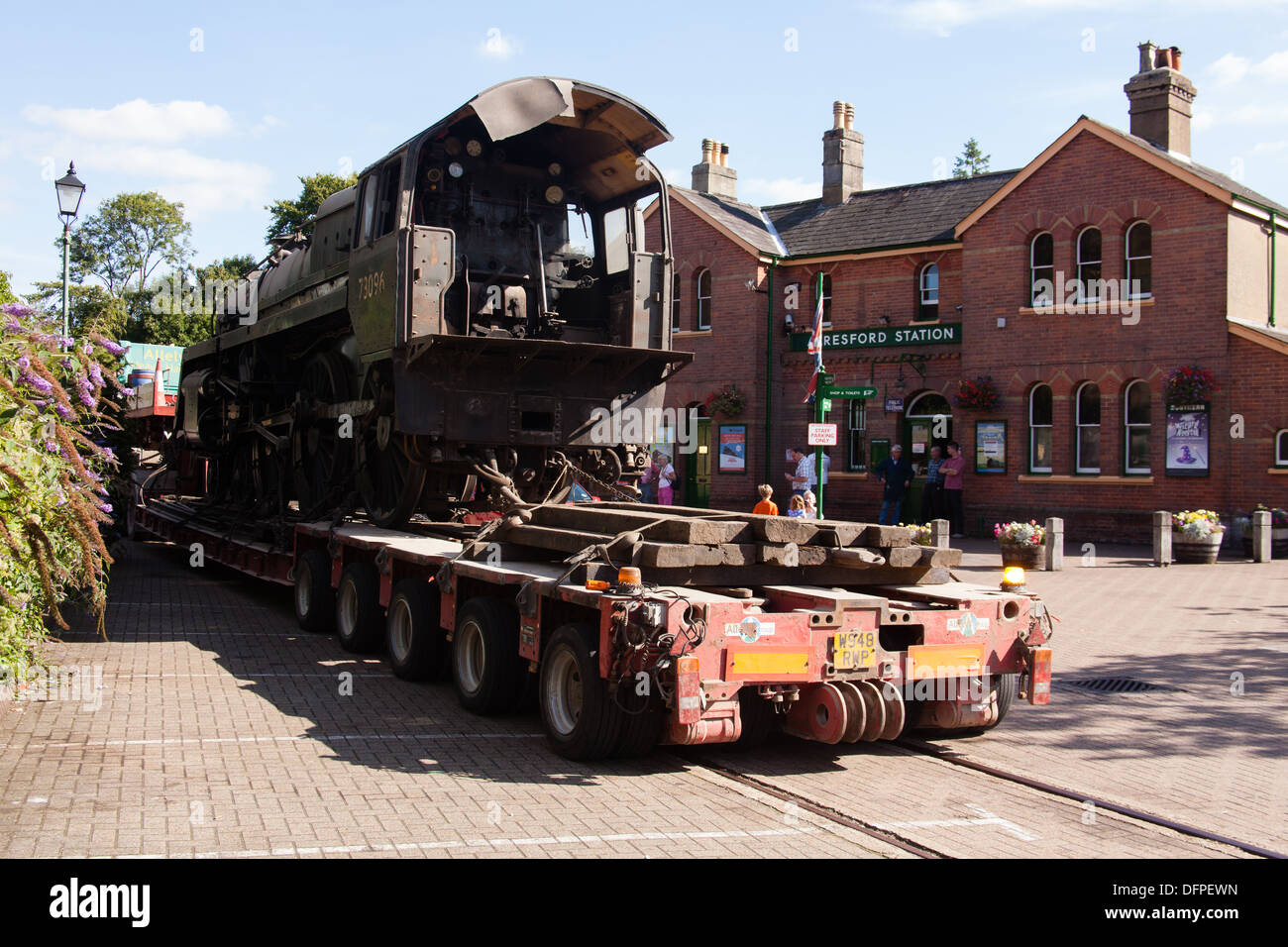 Steam locomotive engine being delivered on the back of a lorry ...