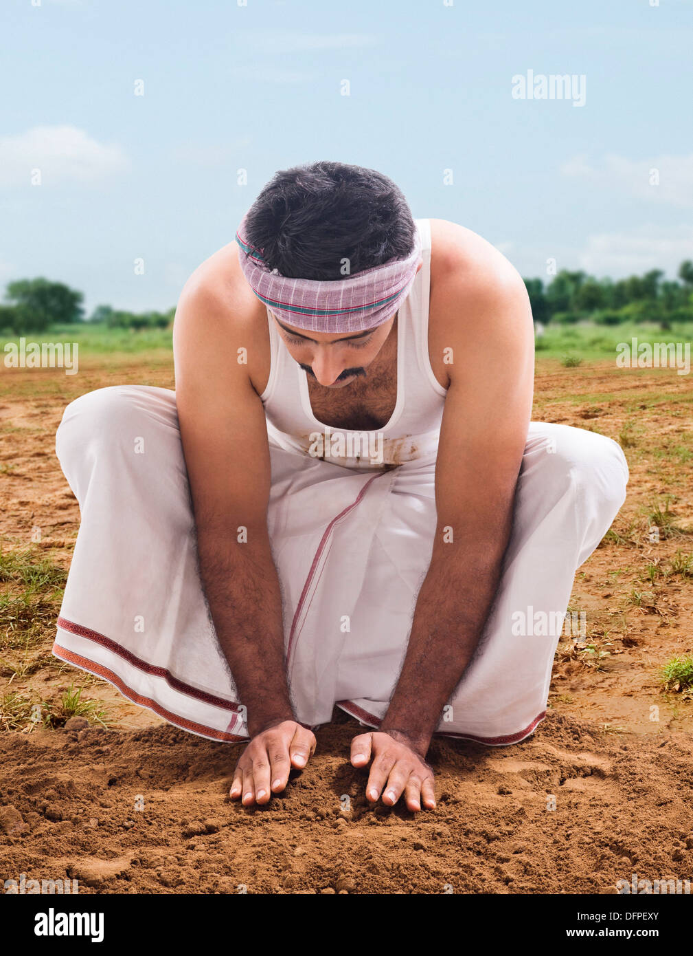 Farmer sowing a seed in a field Stock Photo - Alamy