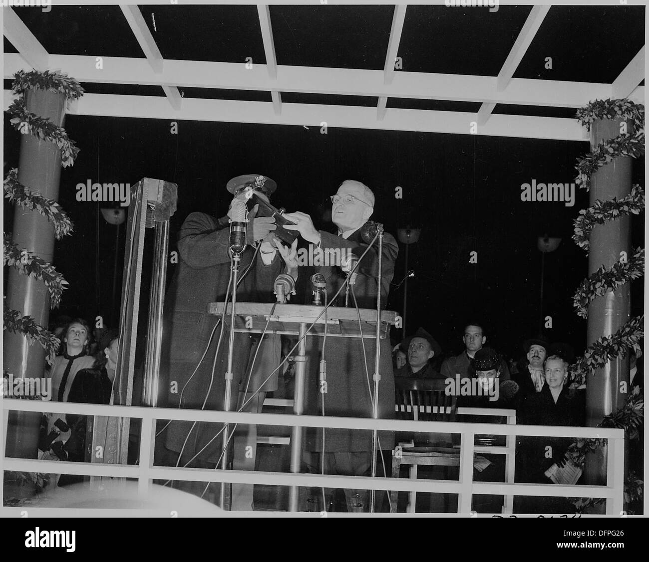 President Harry S. Truman is photographed pressing the button to light ...