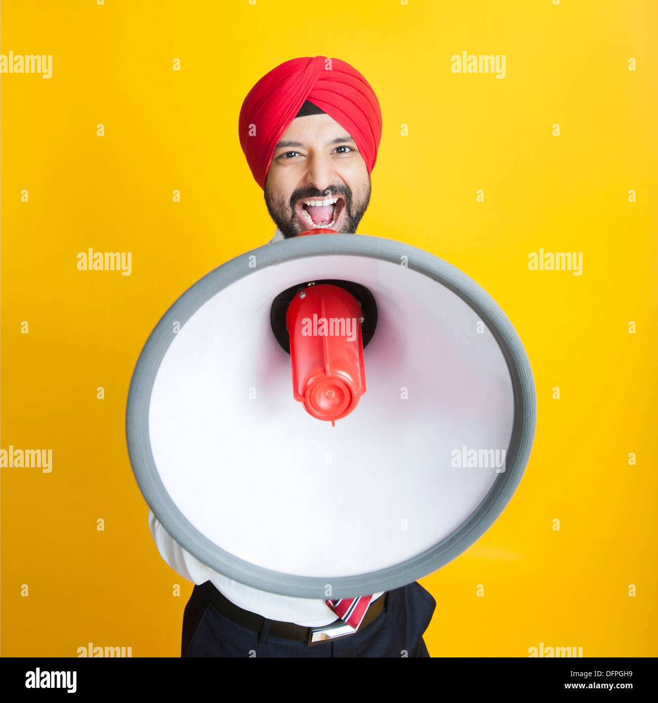 Portrait of a businessman shouting into a megaphone Stock Photo - Alamy